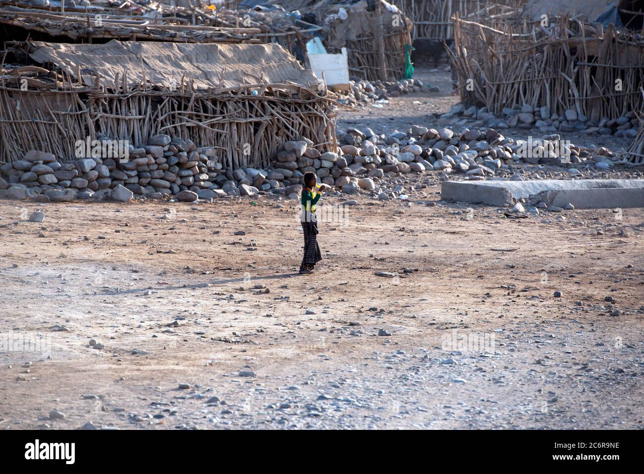A young, indigenous, ethnic Afar tribe girl in her village in the ...