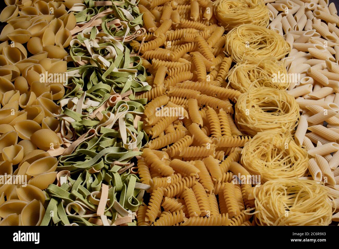 Variety of types and shapes of dry Italian pasta. Italian Macaroni raw ...