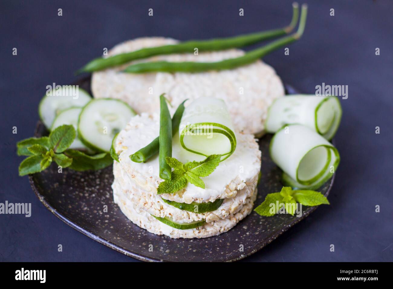 Healthy food. Rice sandwich with cucumber and green beans. Rice cakes ...