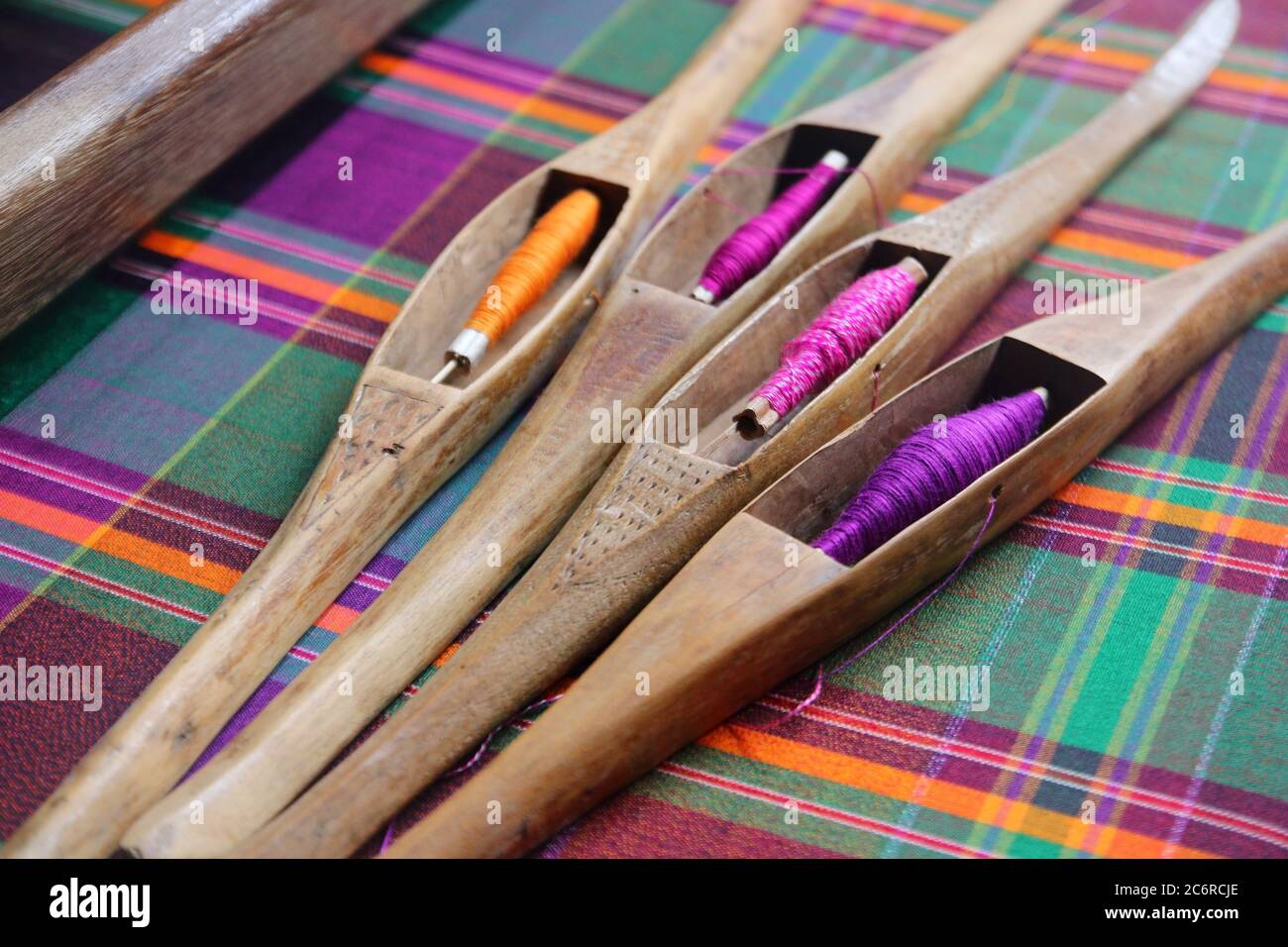 wooden bobbin on silk fabric, traditional weaving of Thai silk Stock ...