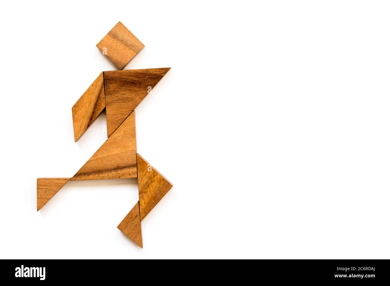 Wood tangram puzzle in running or happy man shape on white background ...