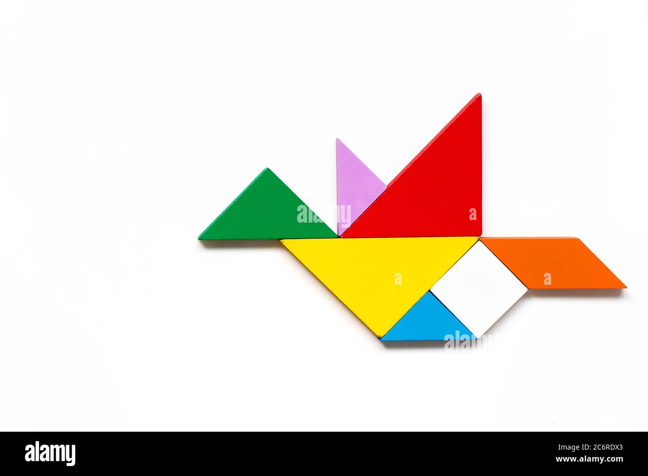 Color wood tangram puzzle in flying bird shape on white background ...