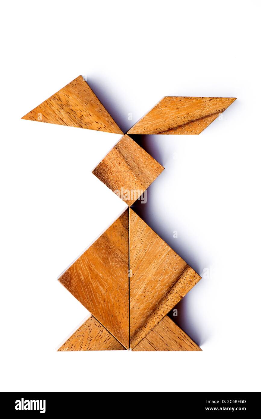 Wood tangram puzzle in rabbit shape on white background Stock Photo - Alamy
