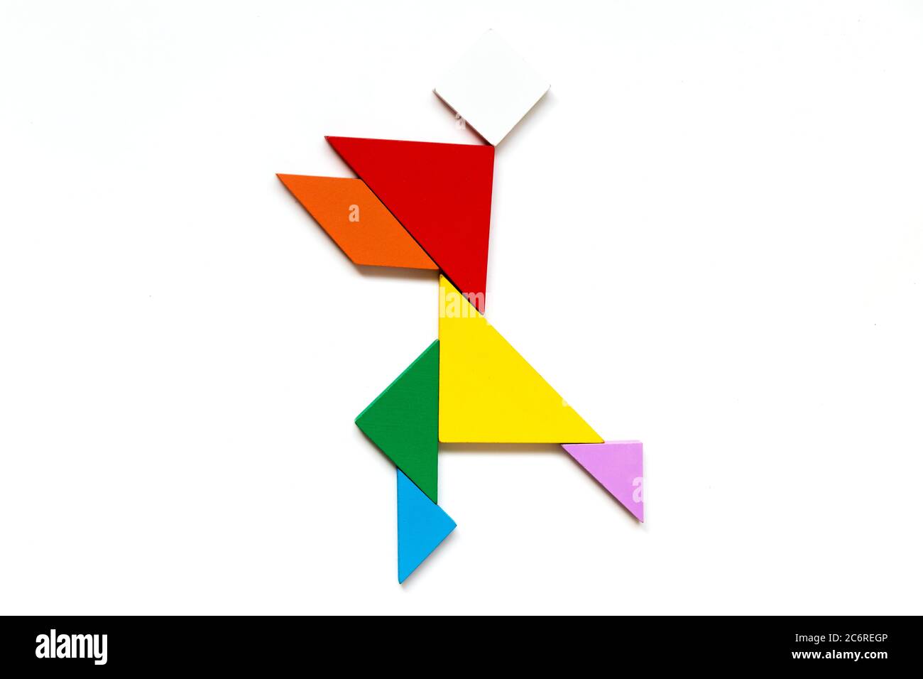 Color wood tangram puzzle in running man shape on white background ...