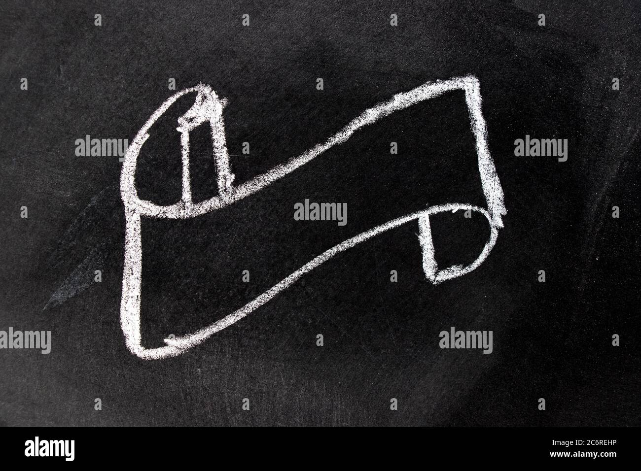 White chalk hand drawing in blank scroll banner shape on blackboard ...