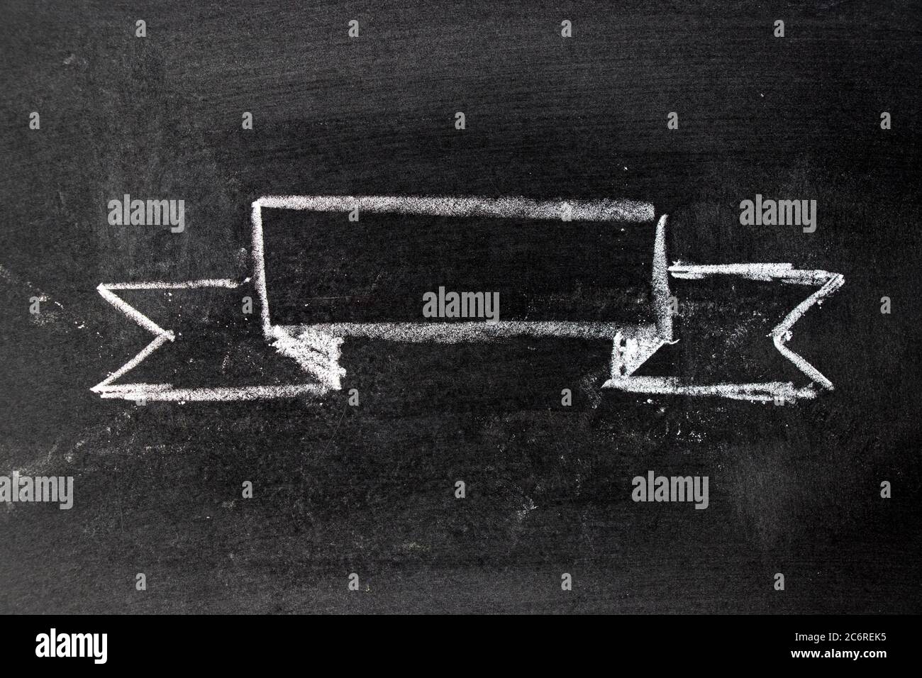 White chalk hand drawing in blank award ribbon shape on blackboard ...