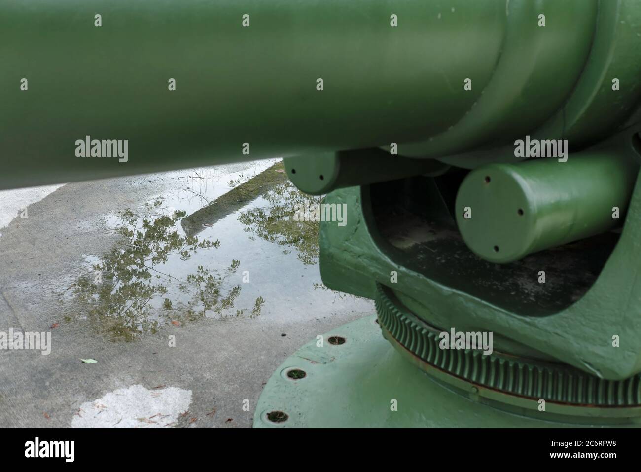 Reflection of an artillery gun in rainwater at the Fort Miles Artillery ...