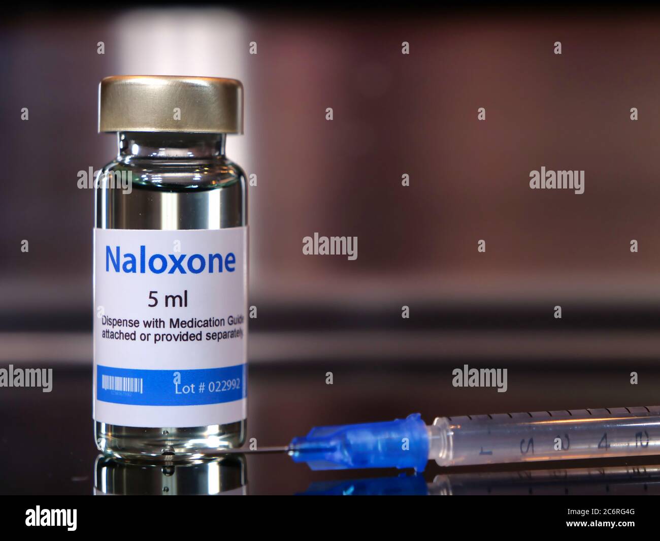 Vial of naloxone with syringe. a fast-acting medication to temporarily ...