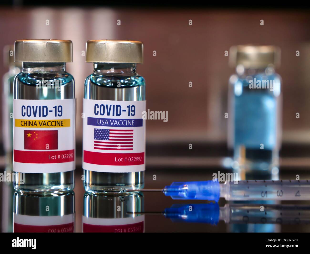 Two vials of covid-19 vaccine with labels of the flags of China and the ...