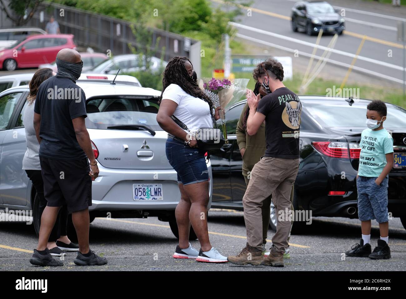Portland, USA. 11th July, 2020. Family and friends gather outside the ...