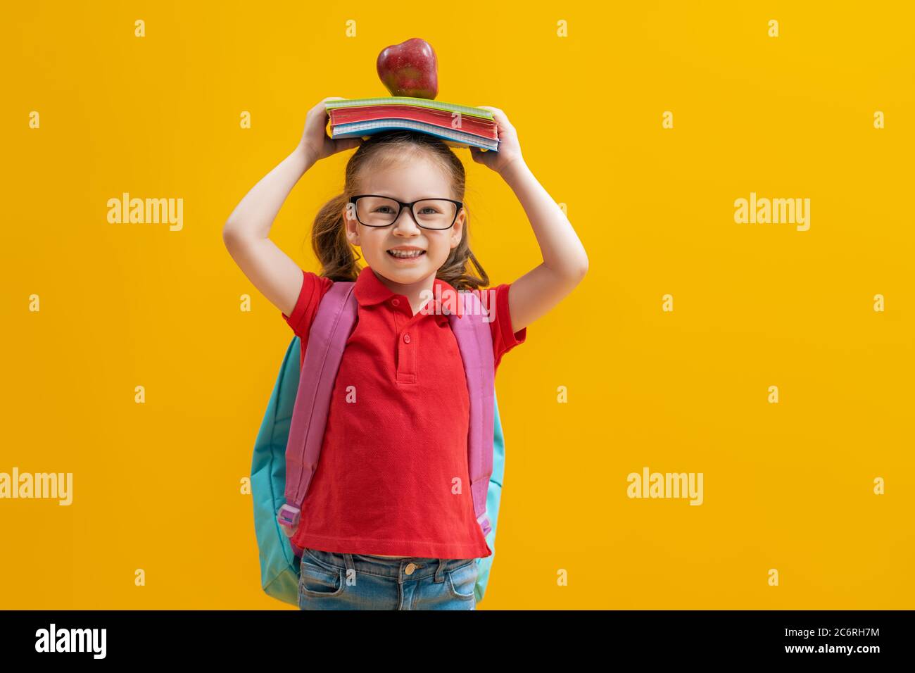 Back to school and happy time! Cute industrious child on color paper ...