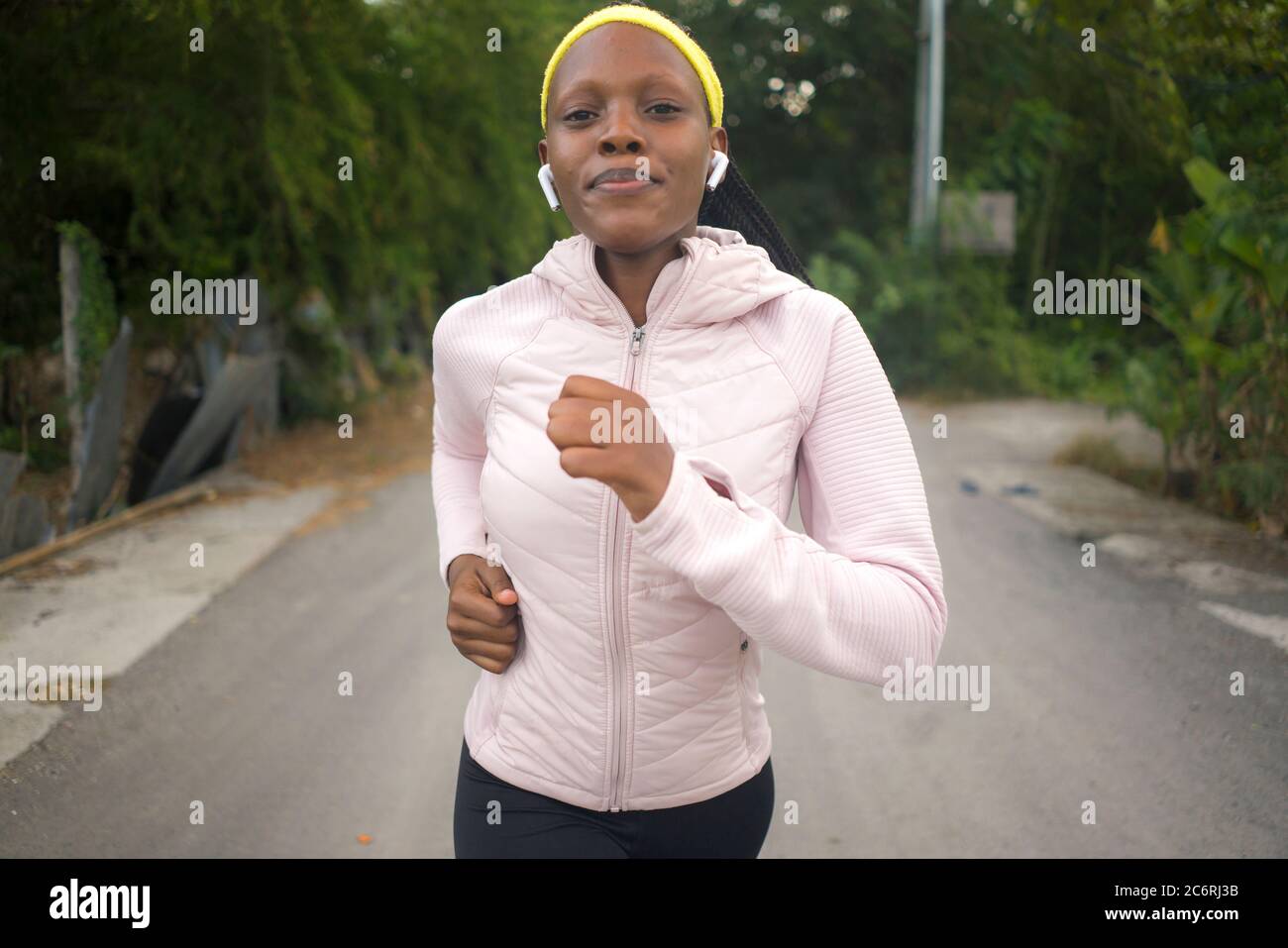young black runner girl enjoying outdoors jogging workout - young ...