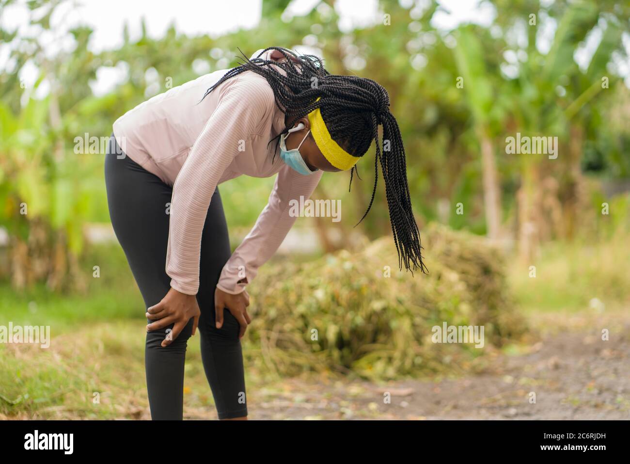 Tired african woman jogger hi-res stock photography and images - Alamy
