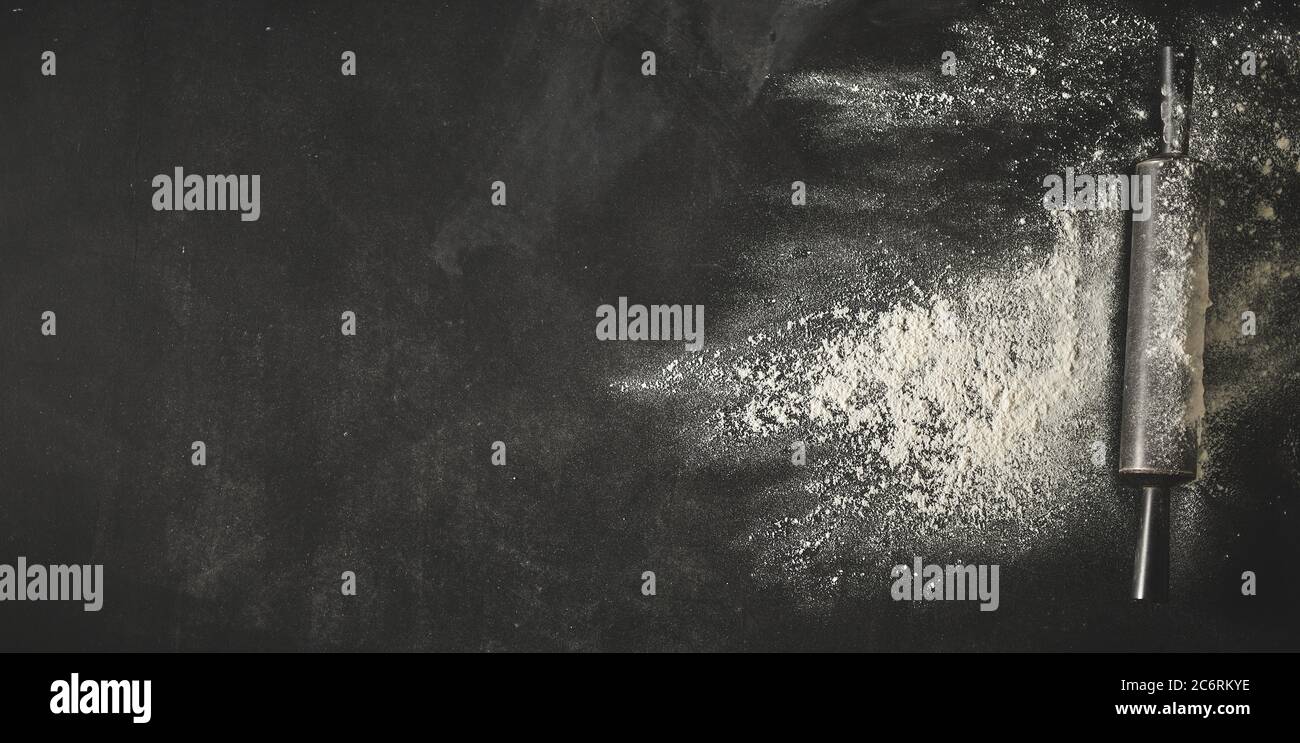 Scattering of flour with metal rolling pin on a panorama banner ...