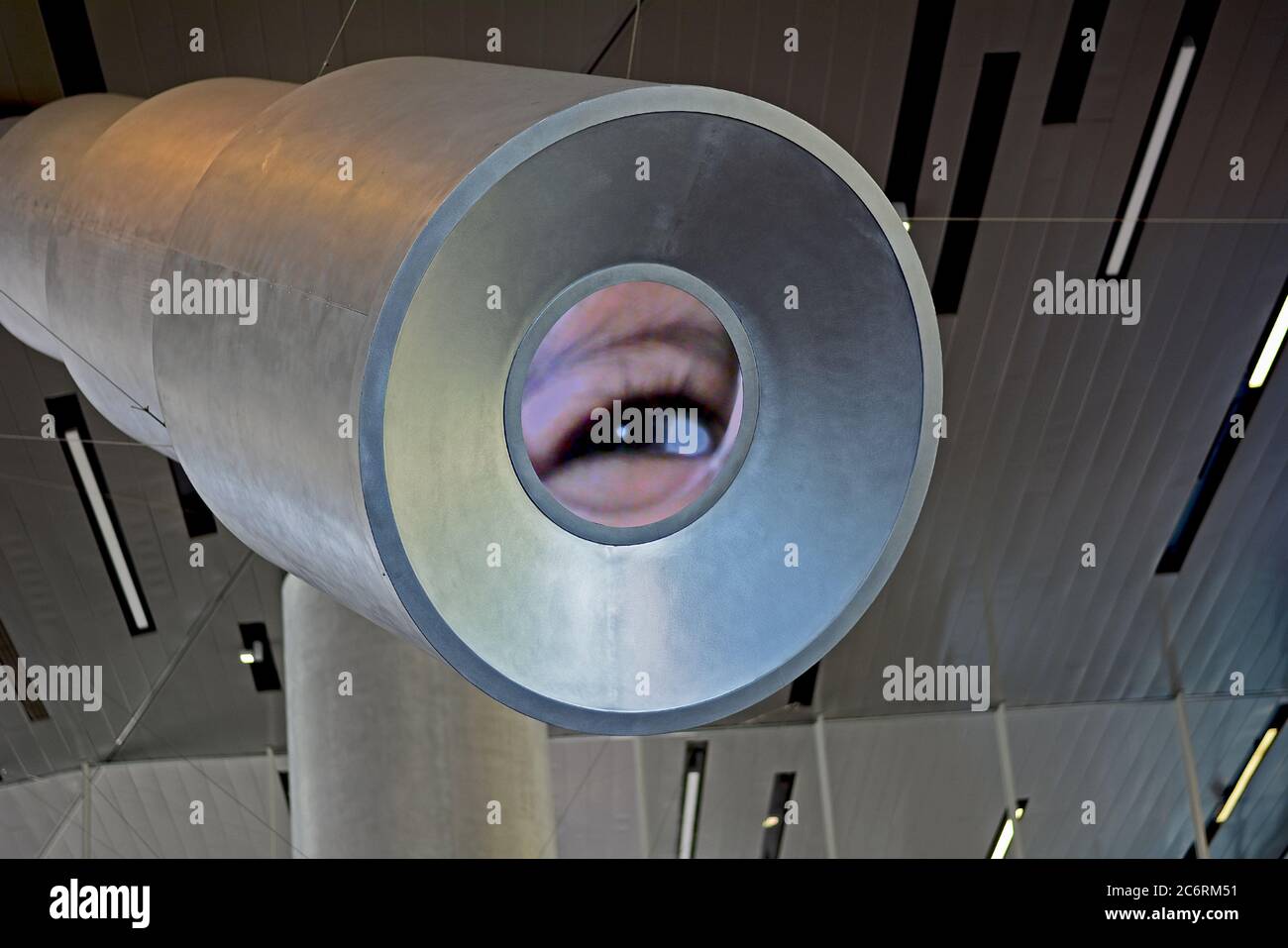 Science experiment at a Science Museum. Looking through a huge optics ...