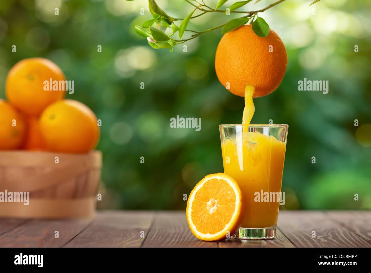 orange juice pouring in glass Stock Photo - Alamy
