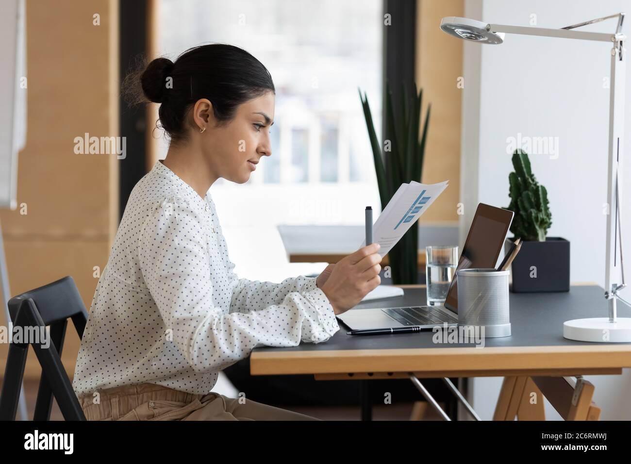 Focused business woman reading documents hi-res stock photography and ...