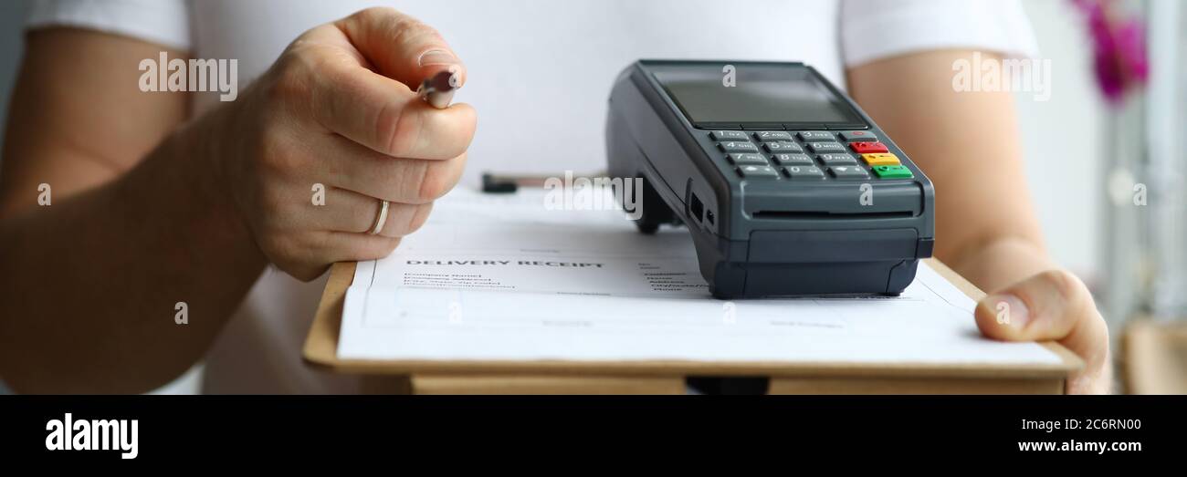 Postman with paper and pen Stock Photo - Alamy
