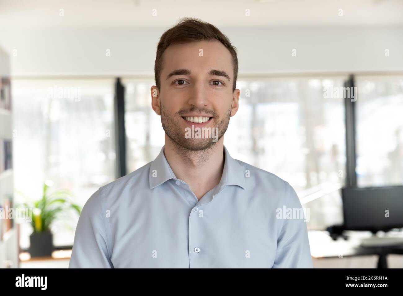 Profile picture of Caucasian male employee posing in office Stock Photo ...