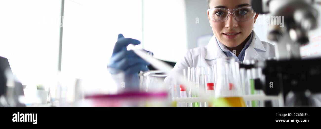 Woman pouring liquid medicine hi-res stock photography and images - Alamy