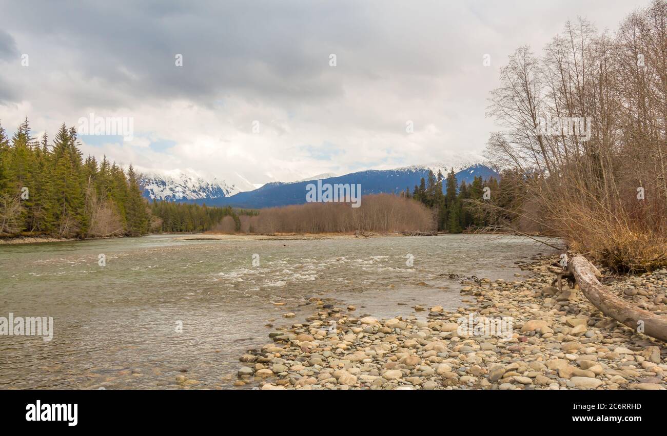 A cold Kalum River in Spring, with Mount Garland in the background ...