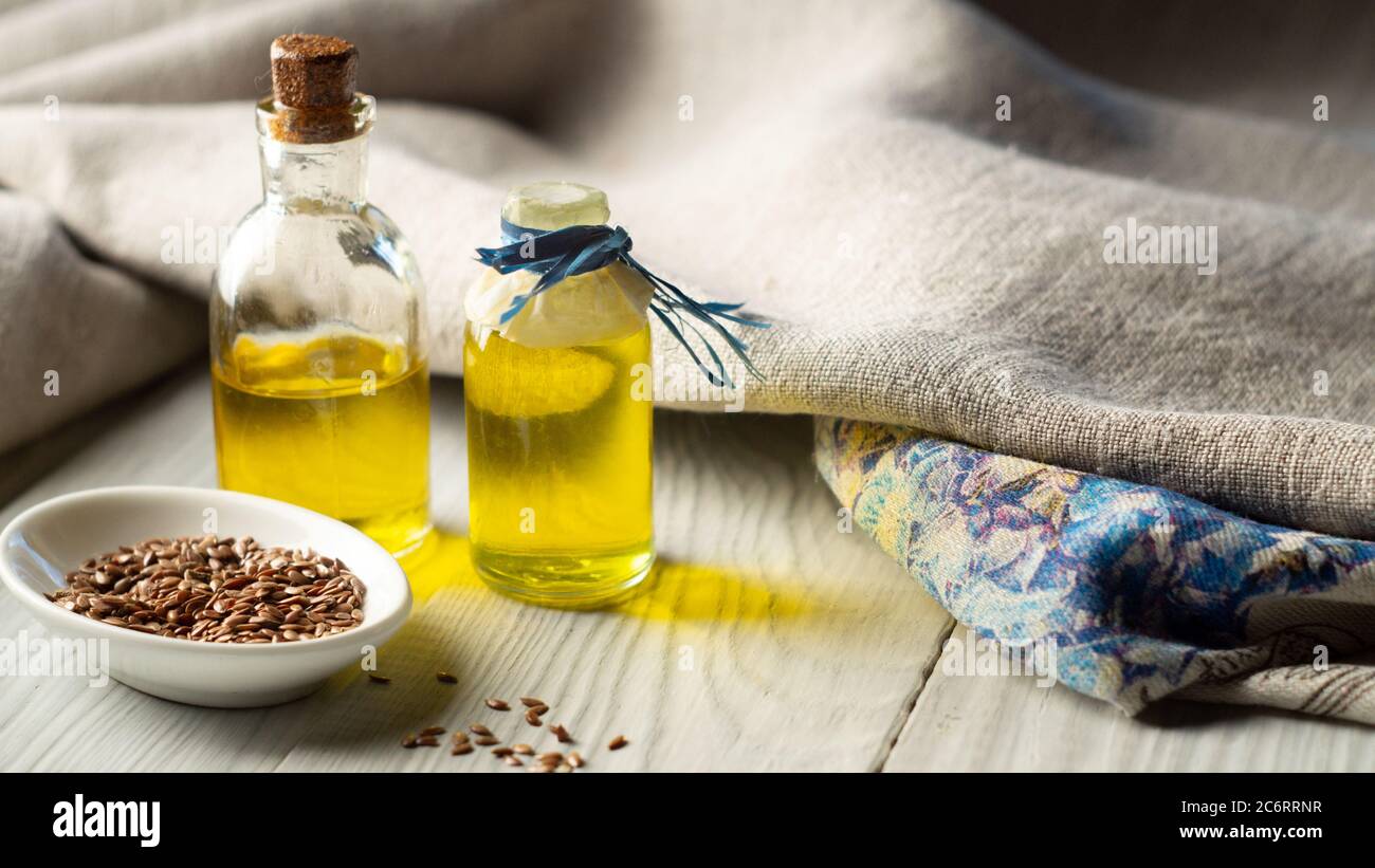 Flax products, linen textiles, flaxseed oil in bottles and flax seed ...