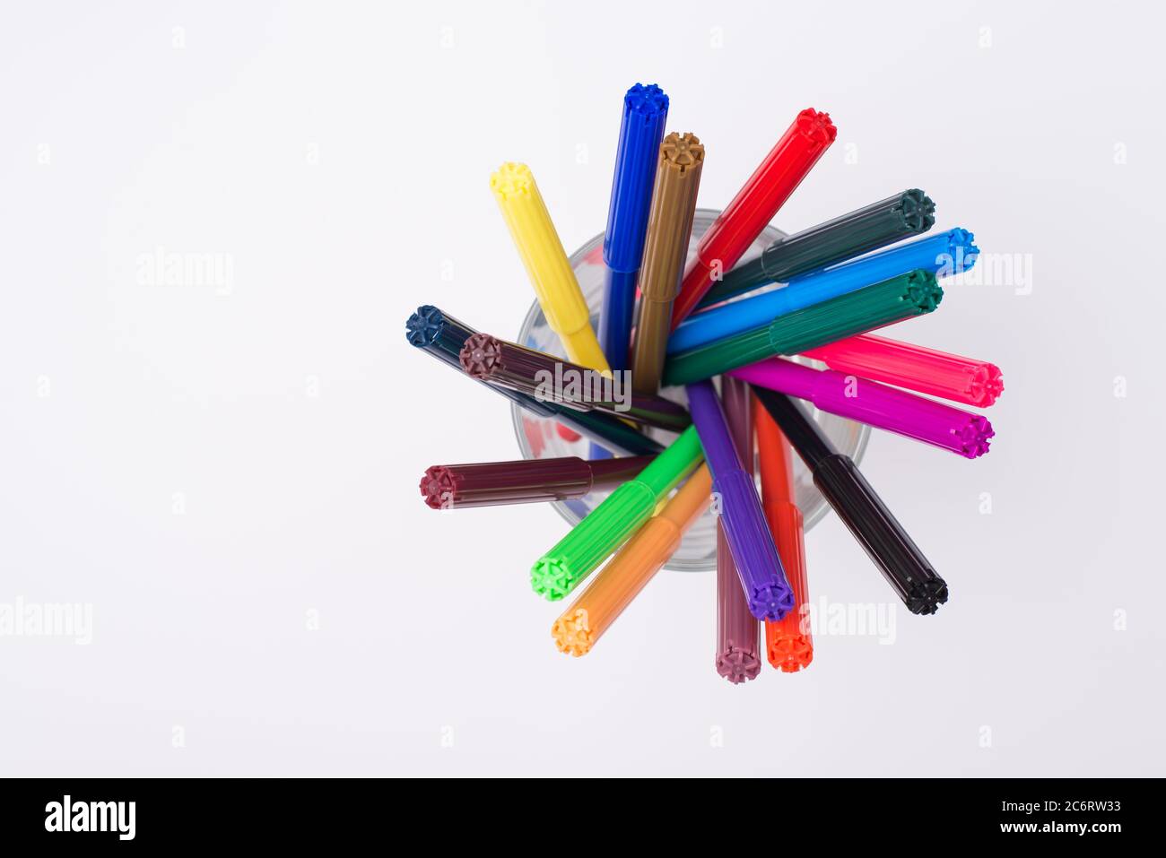 Top above overhead view photo of colorful markers in pencil cup ...