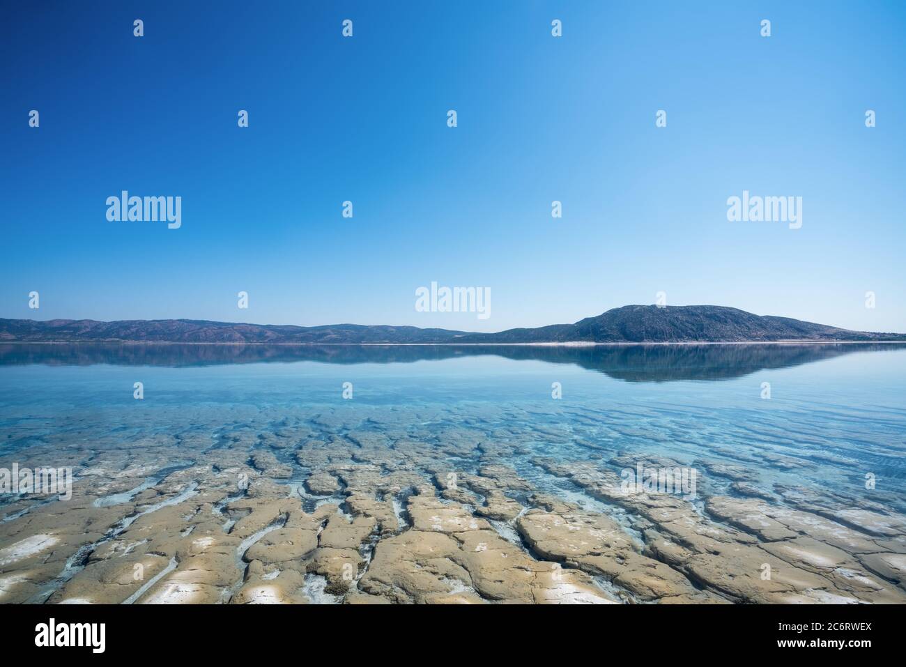 The bottom and surface with crystal clean water of Salda Lake in Turkey ...
