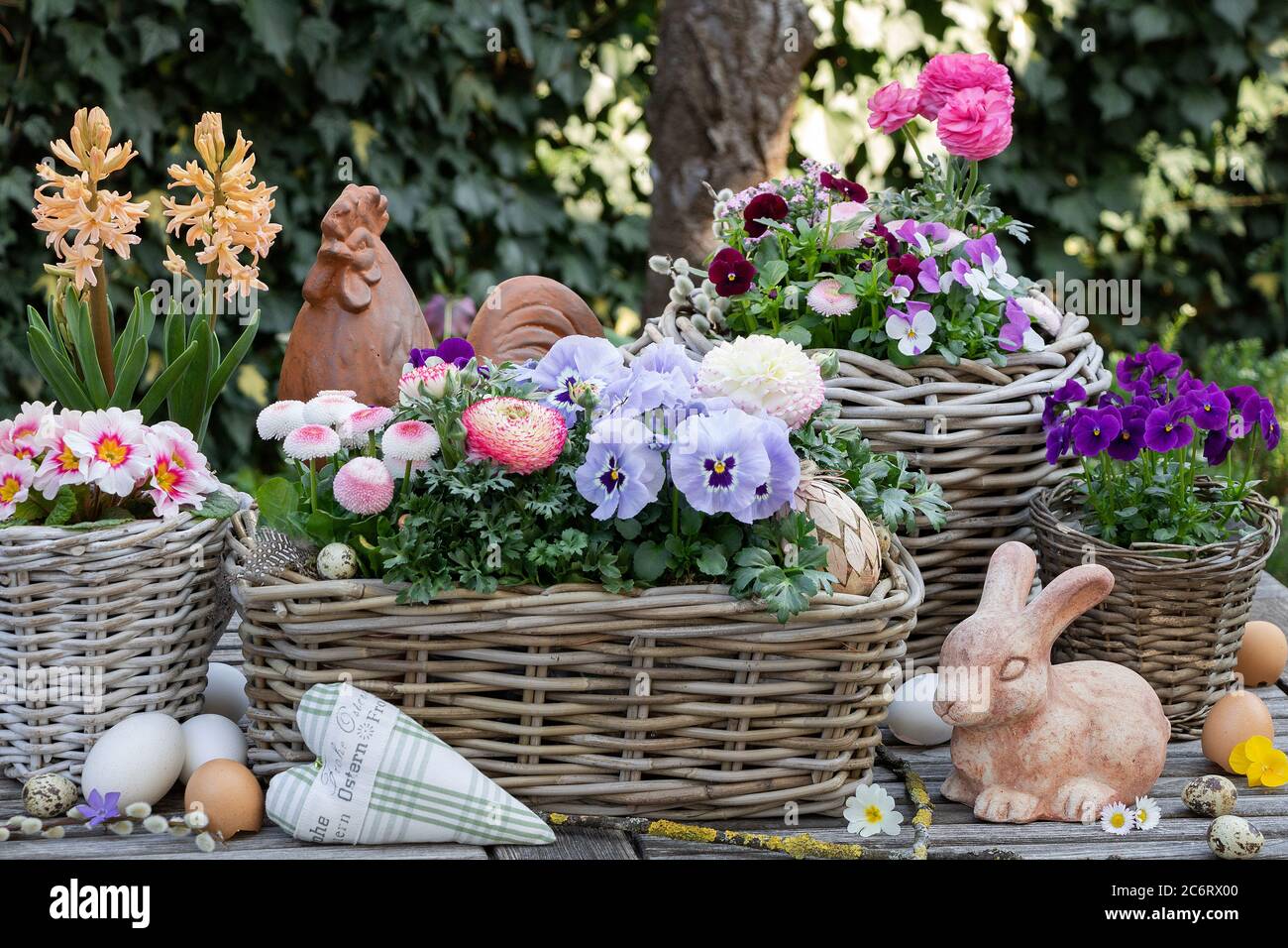 easter decoration with spring flowers in basket and easter bunny Stock ...