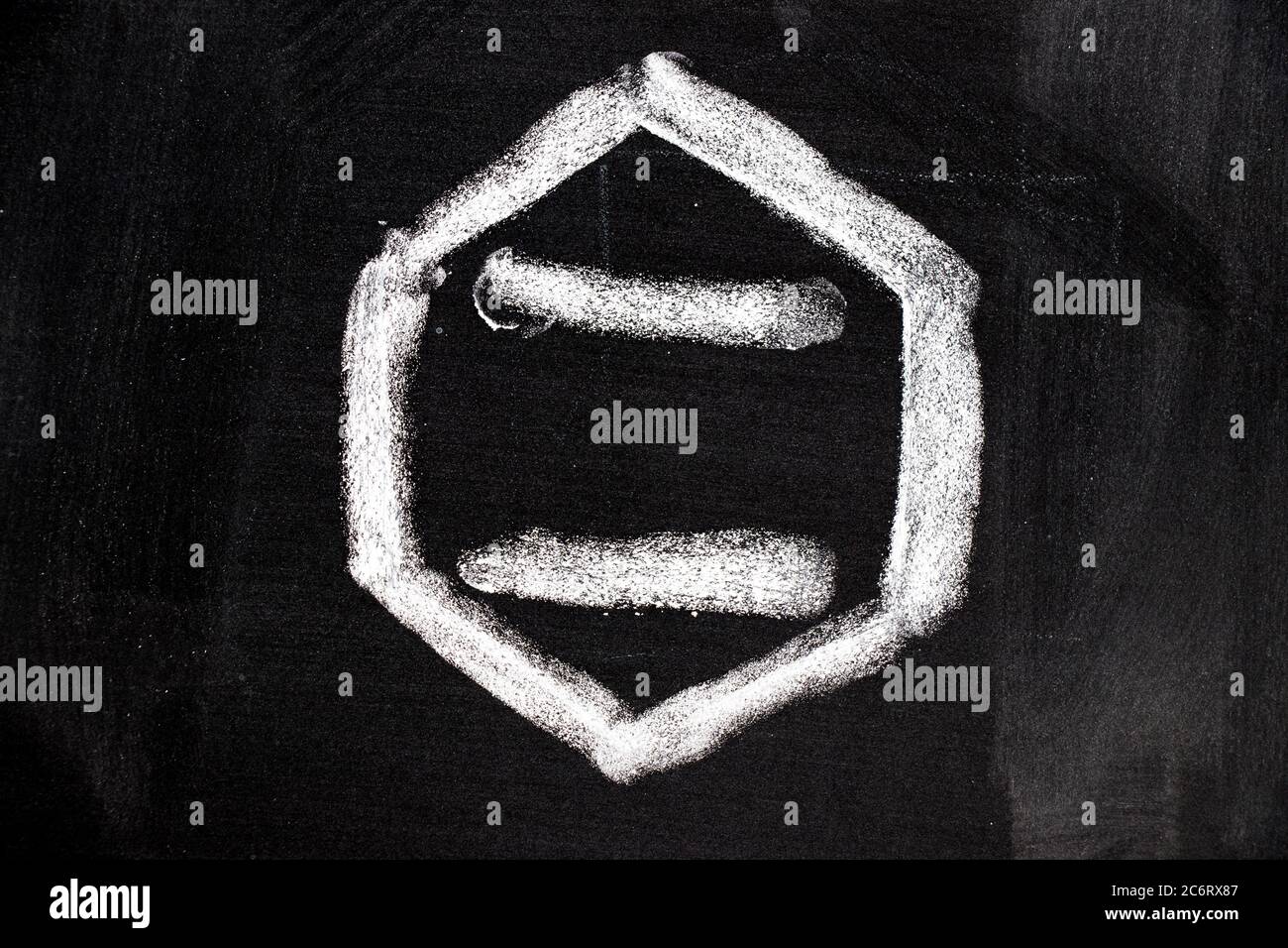 white chalk drawing in blank hexagon shape on blackboard background ...