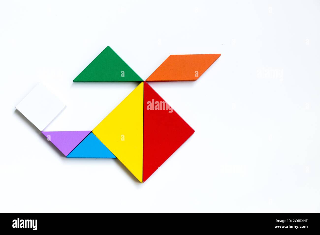 Colorful wood tangram puzzle in helicopter shape on white background ...