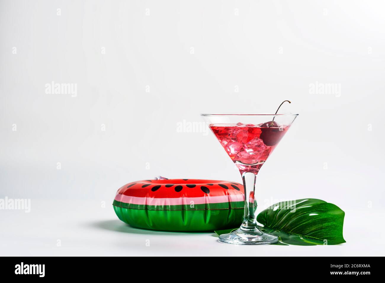 Inflatable ring and cocktail Stock Photo - Alamy
