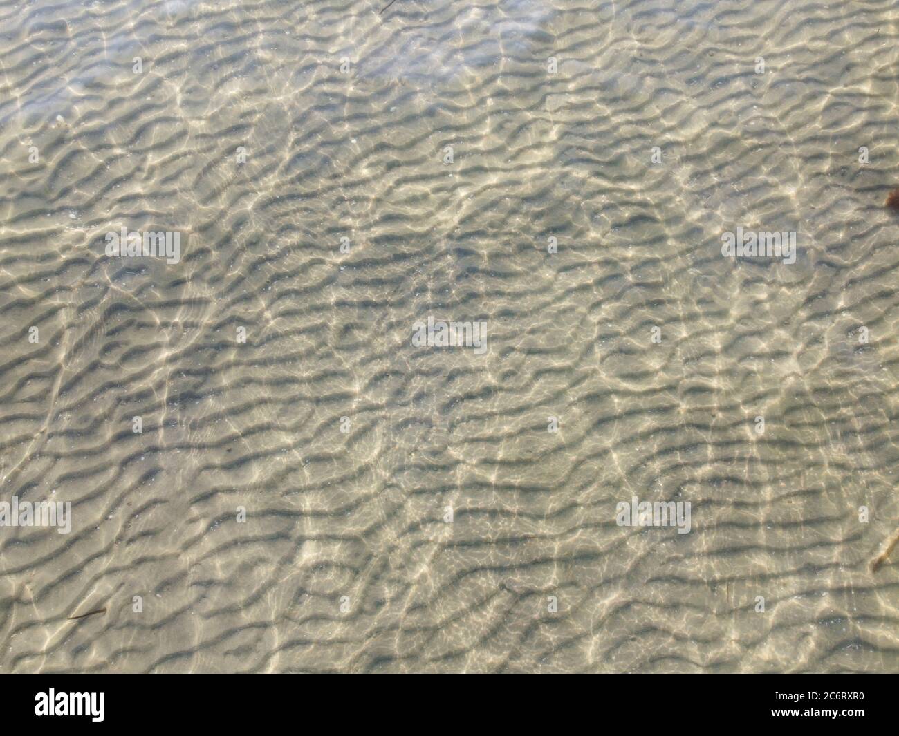 Beach and prose water, clean sand under water Stock Photo - Alamy
