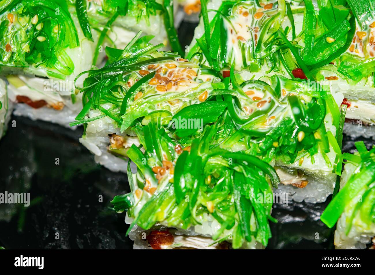 Rolls with fish, cheese and green algae. A traditional Japanese dish ...