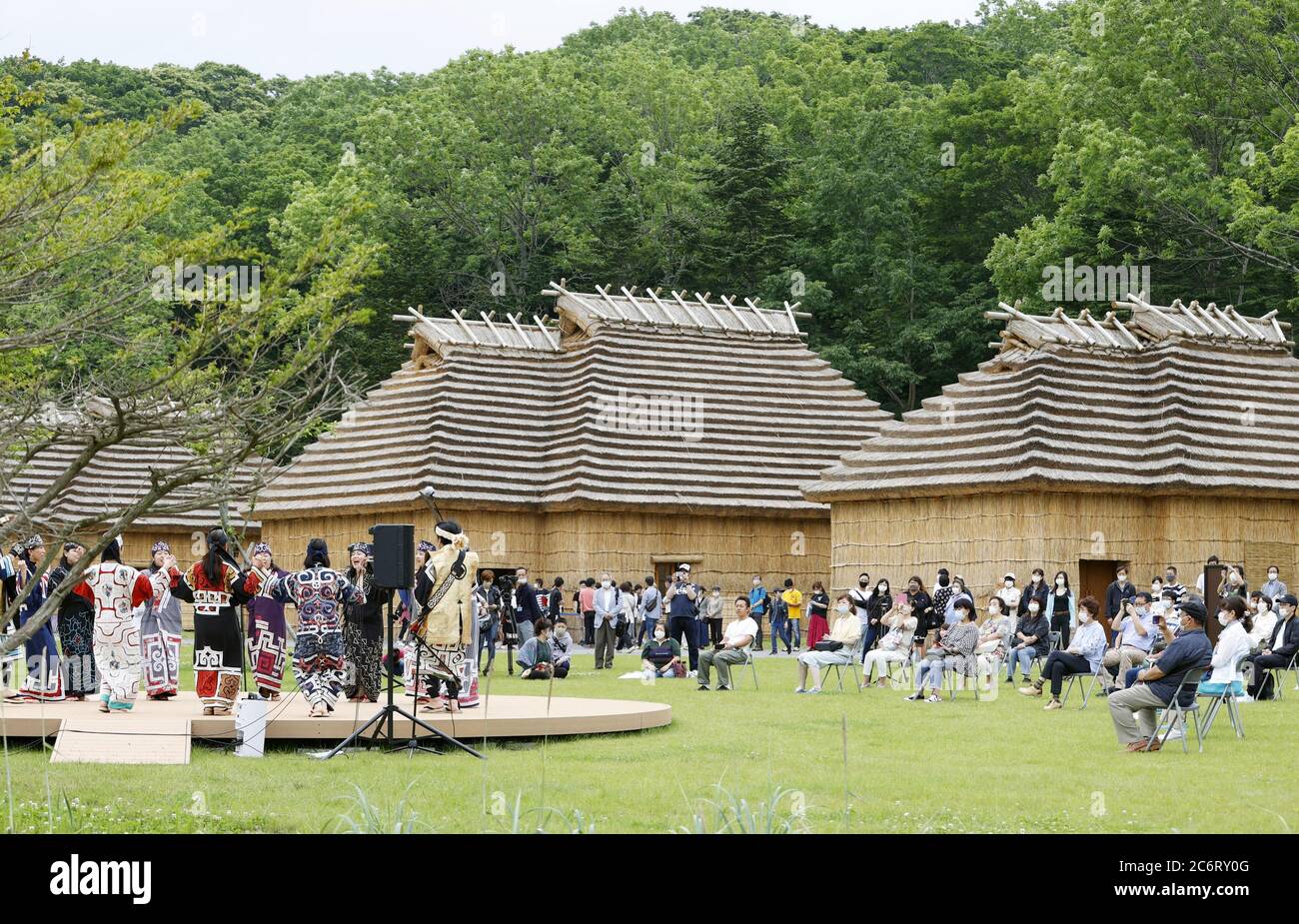 People watch a traditional dance at the just opened "Upopoy" Ainu ...