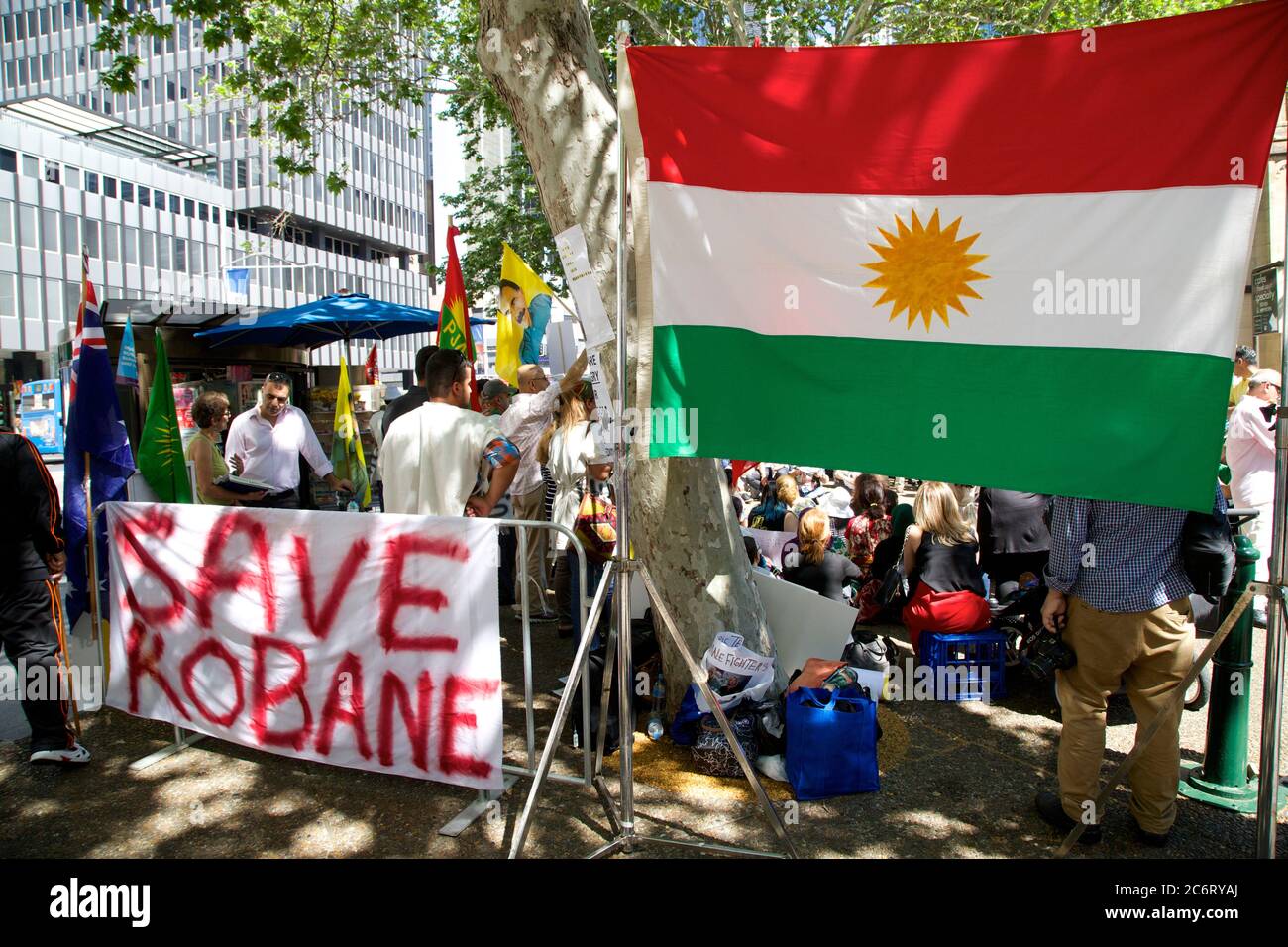 A banner next to the flag of Kurdistan at the Kurdish rally against ...