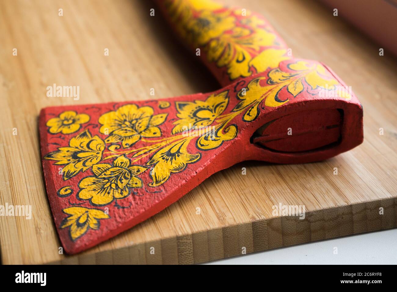 axe in Khokhloma. An axe painted in Russian folk style. Russian ...