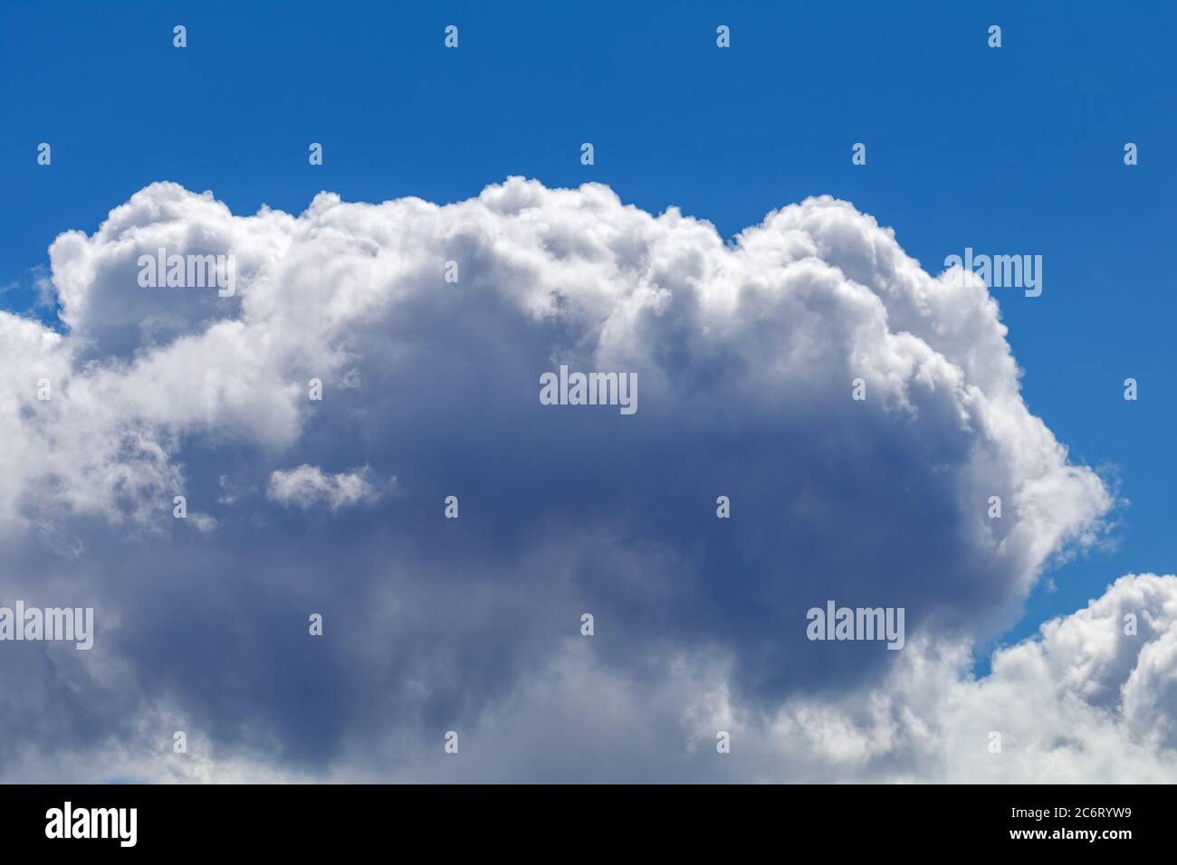 Cumulus clouds against a blue sky Stock Photo - Alamy
