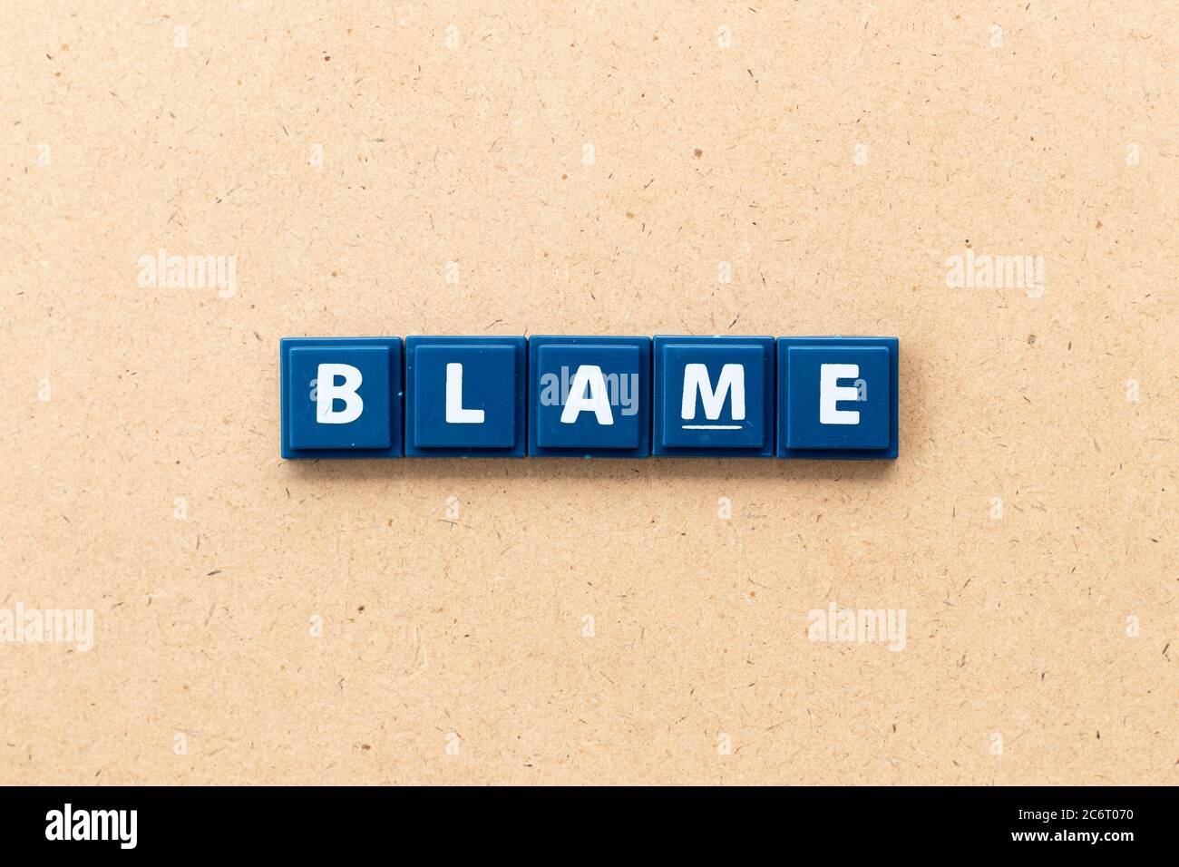 Tile letter in word blame on wood background Stock Photo - Alamy