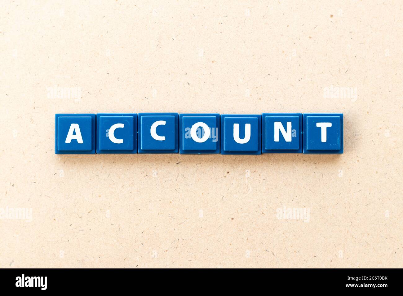 Tile alphabet letter in word account on wood background Stock Photo - Alamy