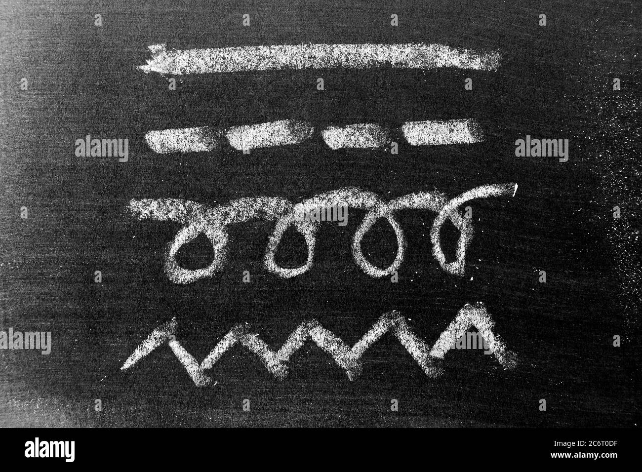 White color chalk hand drawing in set of line shape on black board ...