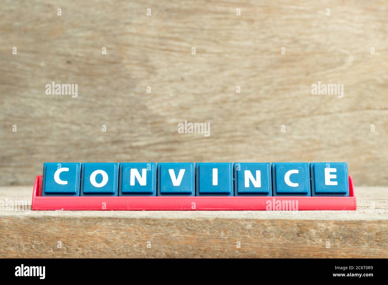 Tile letter on red rack in word convince on wood background Stock Photo ...