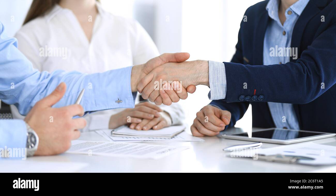 Business people shaking hands at meeting or negotiation, close-up ...