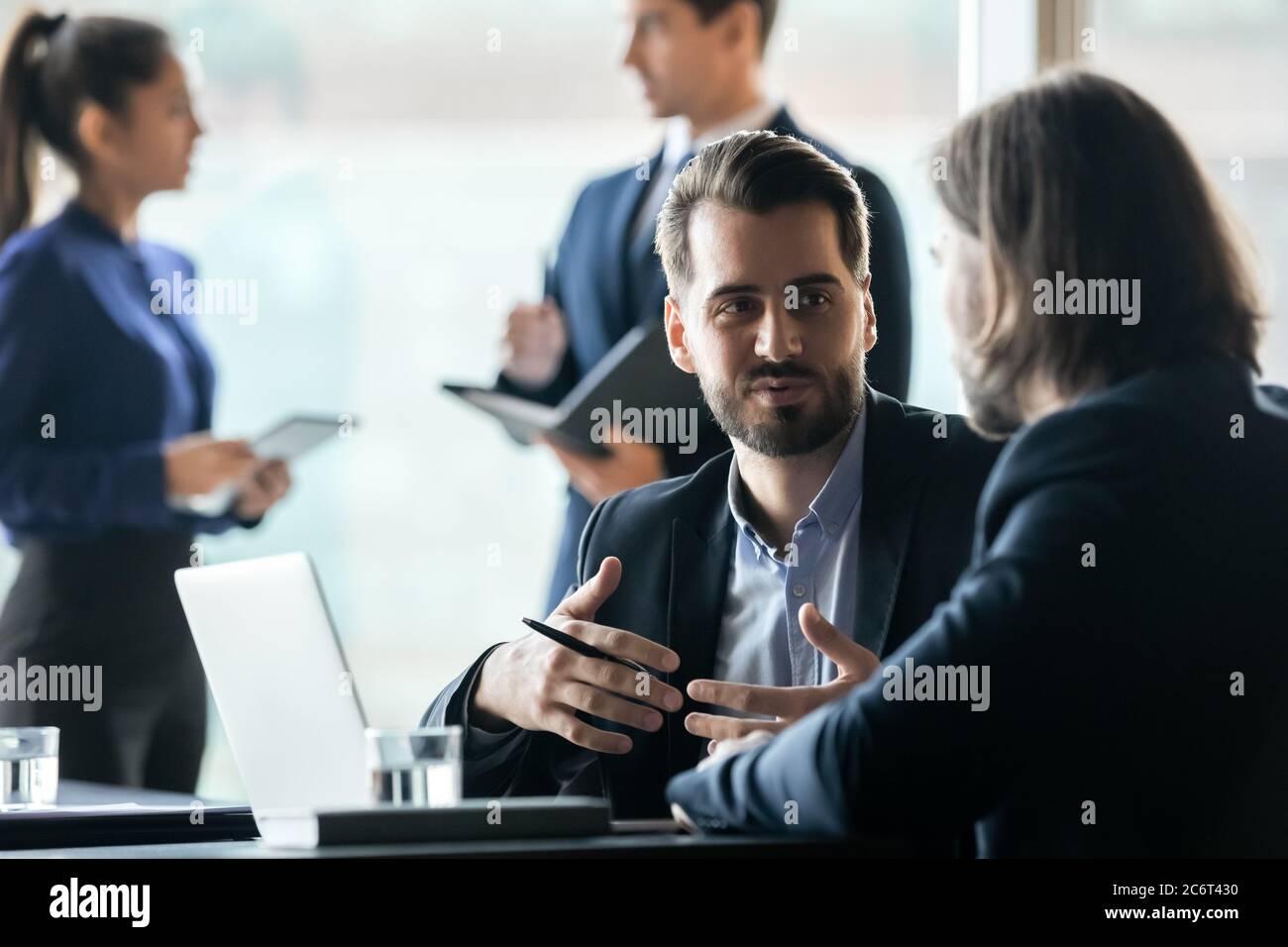 Two male managers discussing project problem solution Stock Photo - Alamy
