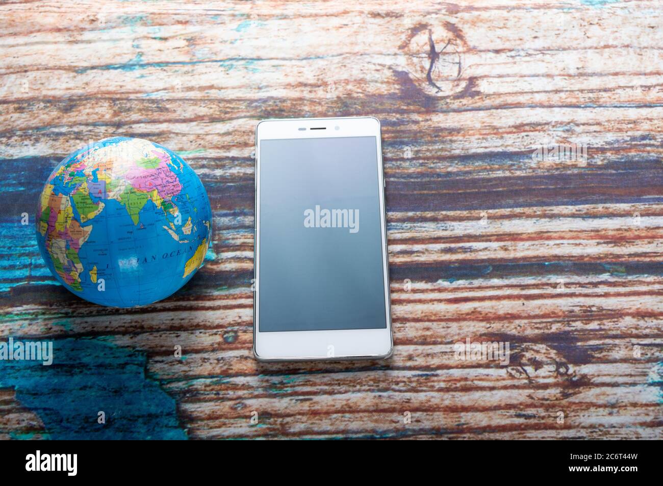Smartphone and globe. Communication around the globe Stock Photo - Alamy