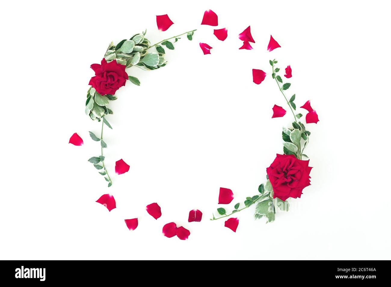 Round frame made of red roses flowers and green leaves on white ...