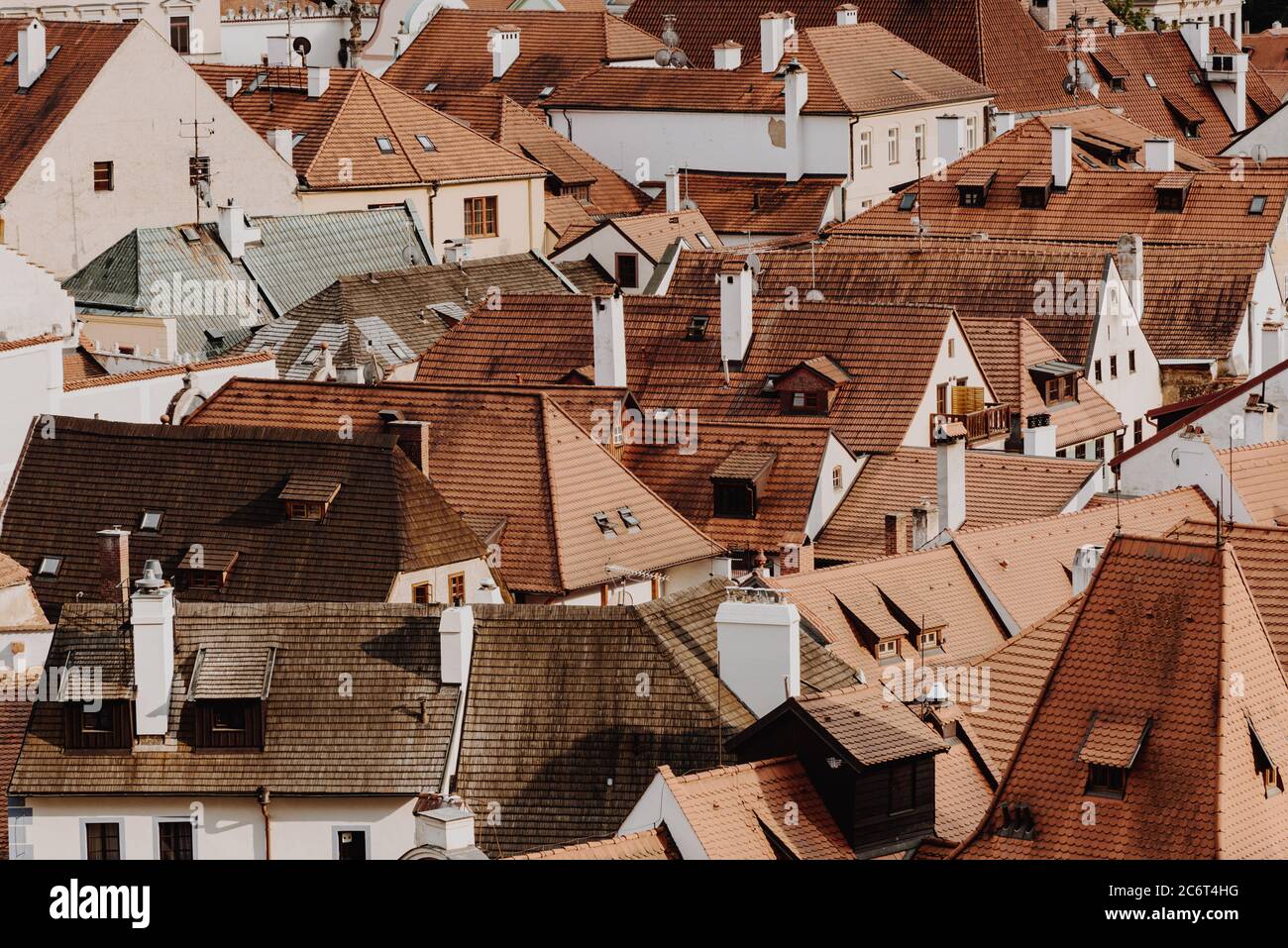 Red rooftops shot from drone, old houses in the summer afternoon light ...