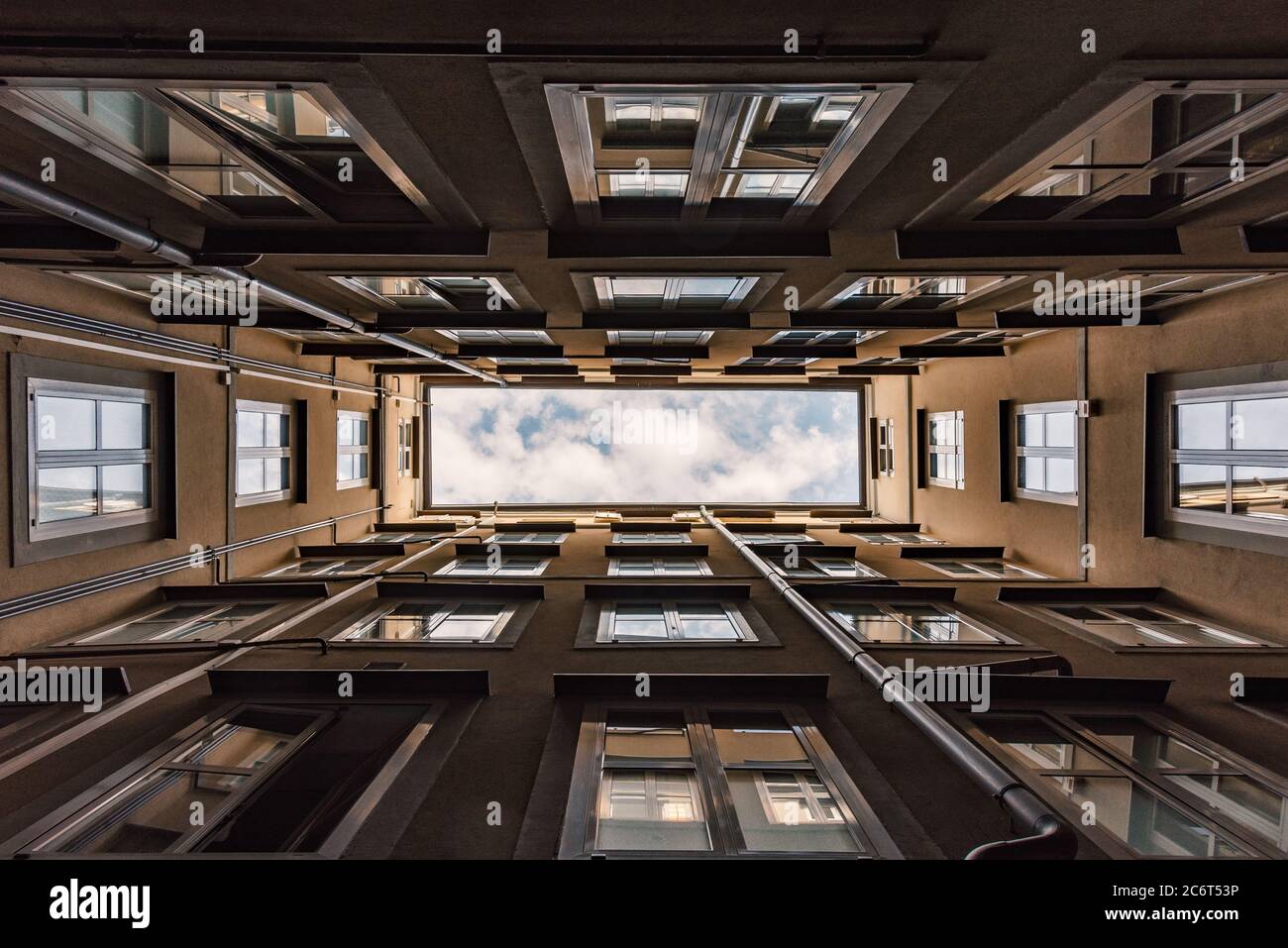 Sky view from the bottom of the courtyard of the building, forming a ...