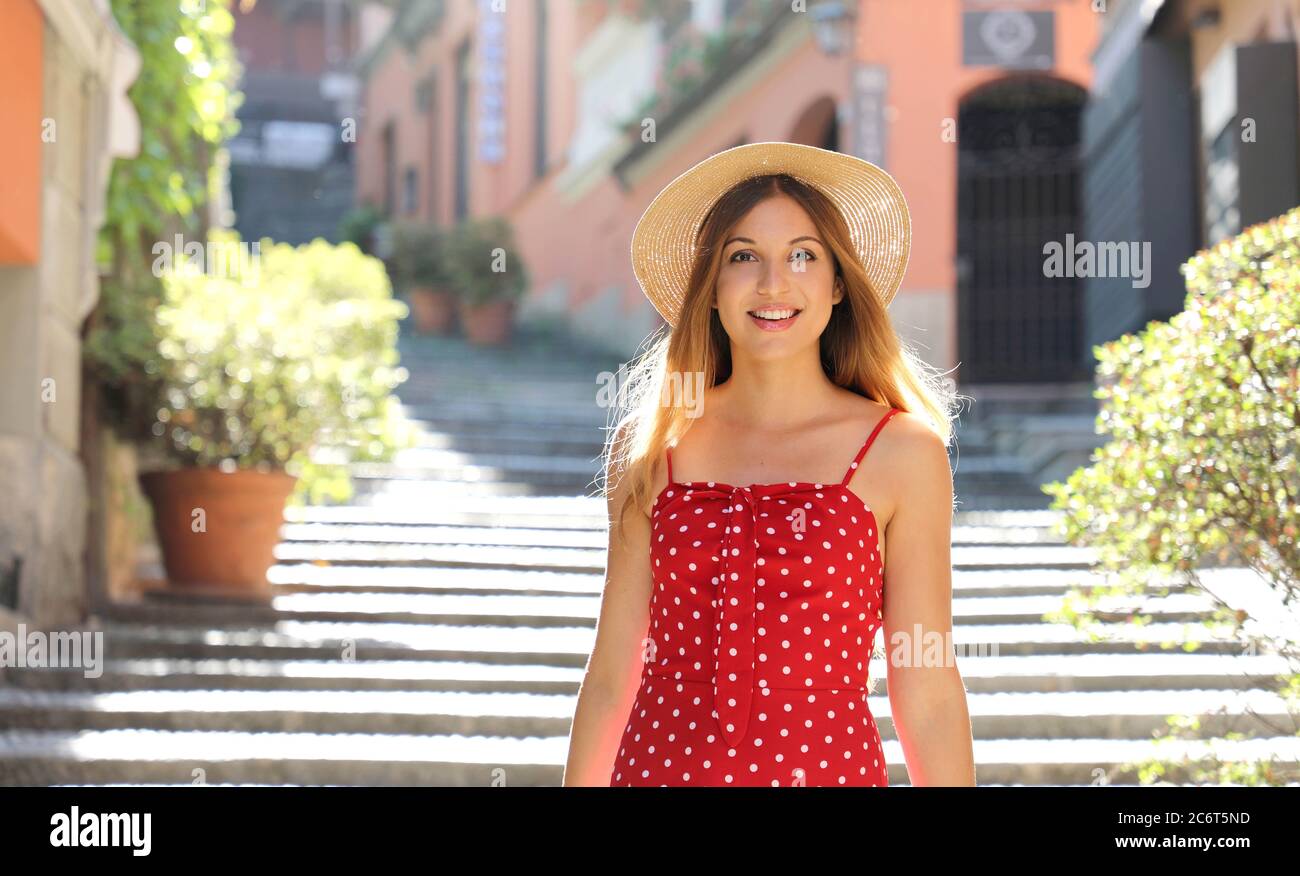 Happy travel tourist woman going downstairs in Bellagio on Lake Como ...
