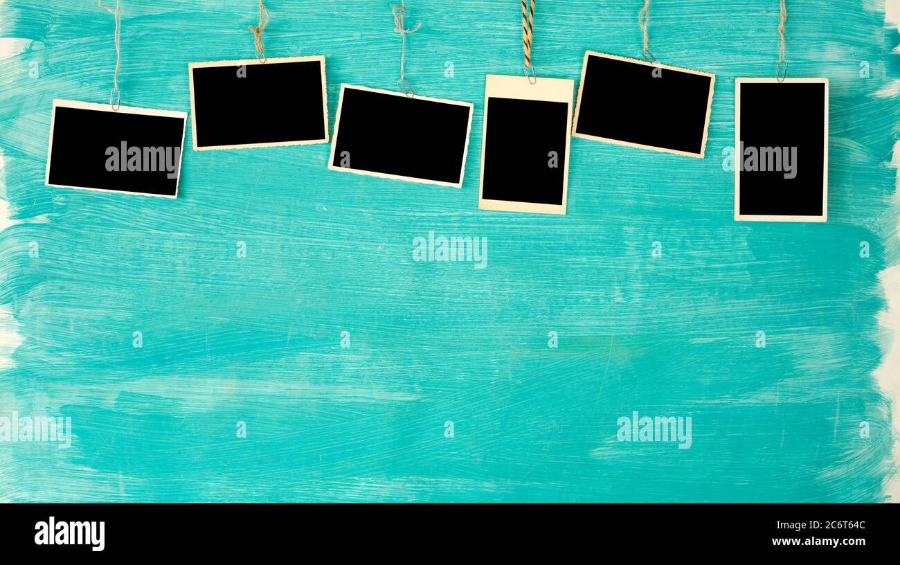 old empty photo frames, hanging vintage empty photo prints, free space ...